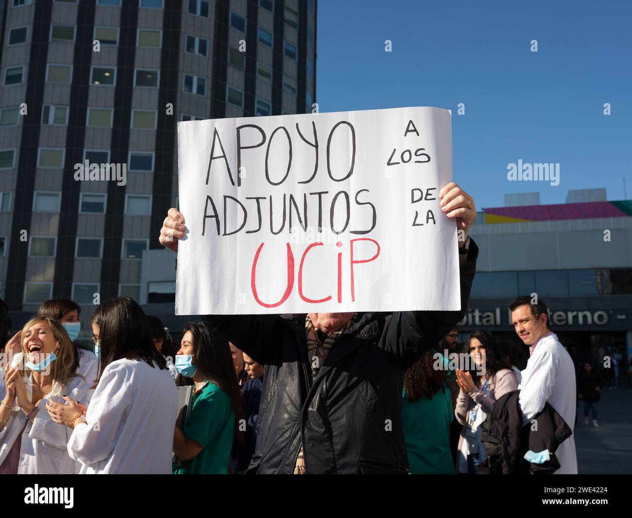 Demonstrators hold placards during a protest after the closure of the ...