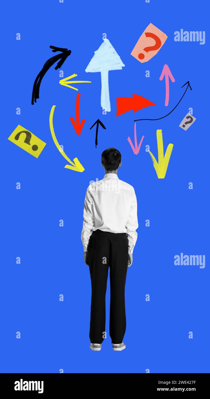 Back view of young employee, man standing in front of many professional ...