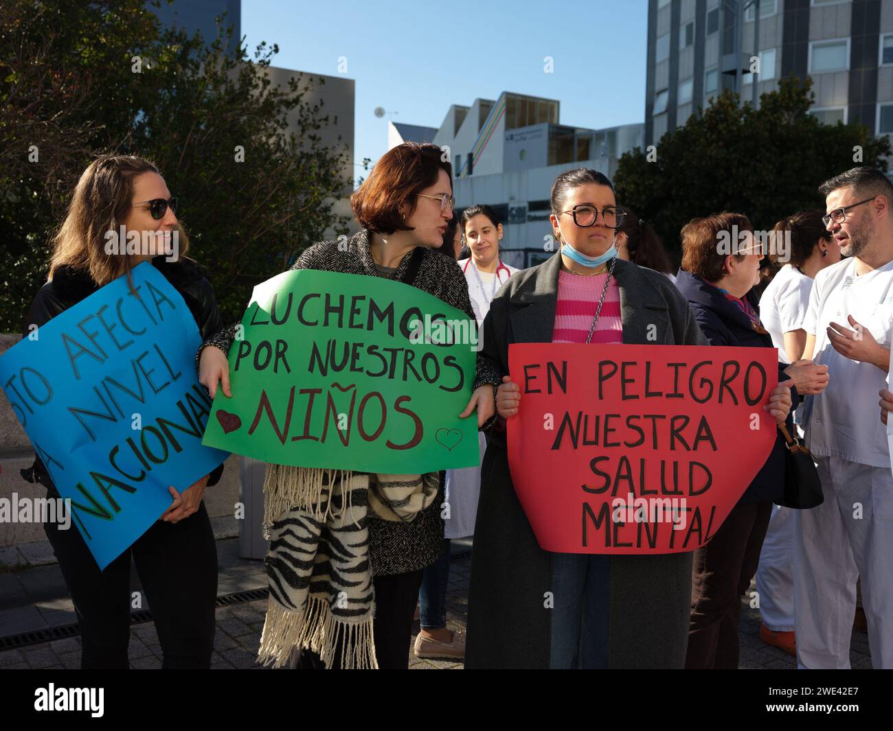 Demonstrators hold placards during a protest after the closure of the ...