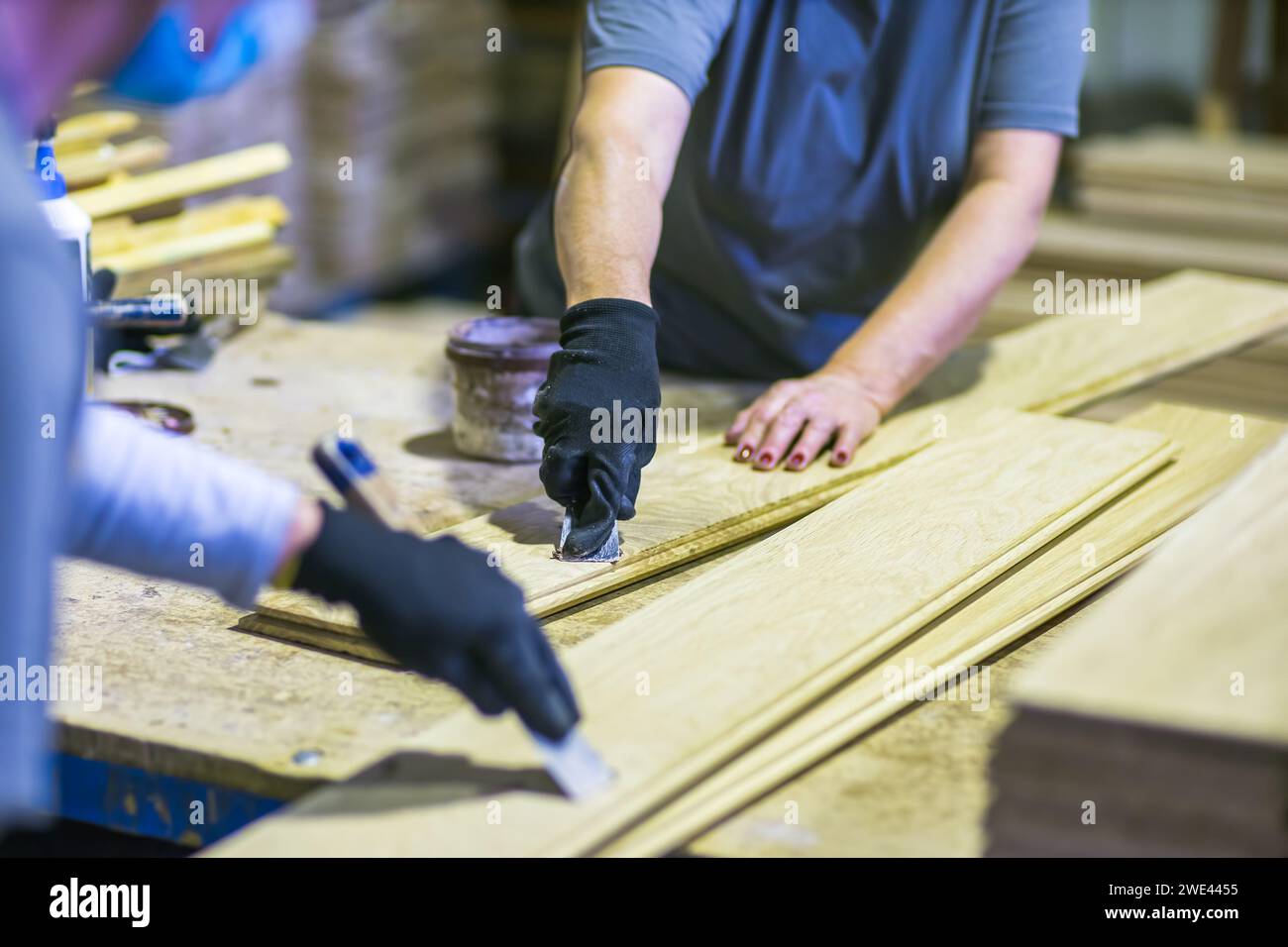 workers assembling wooden flooring together in factory Stock Photo - Alamy