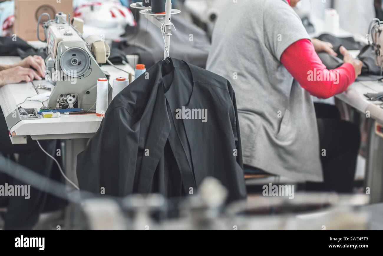 workers working on sewing machines in clothing industry Stock Photo - Alamy