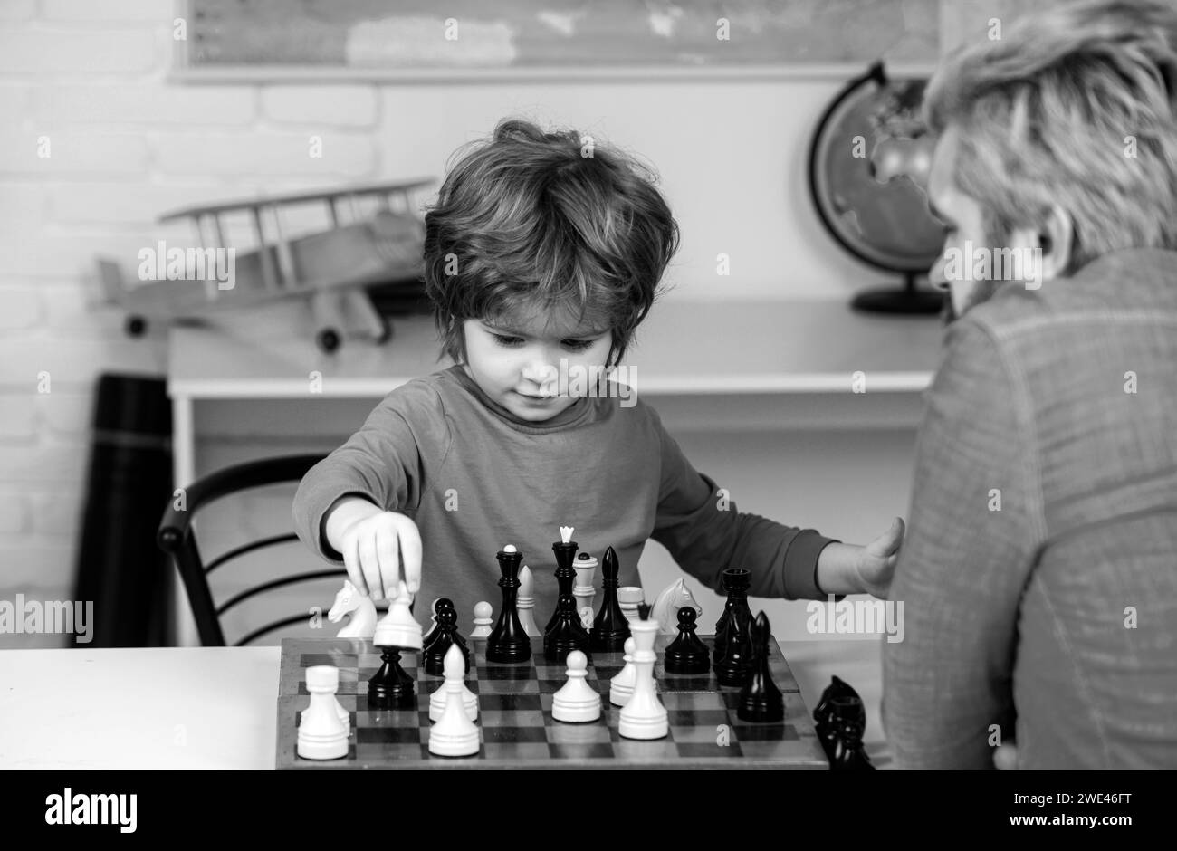 Child and childhood. Clever concentrated and thinking child while ...