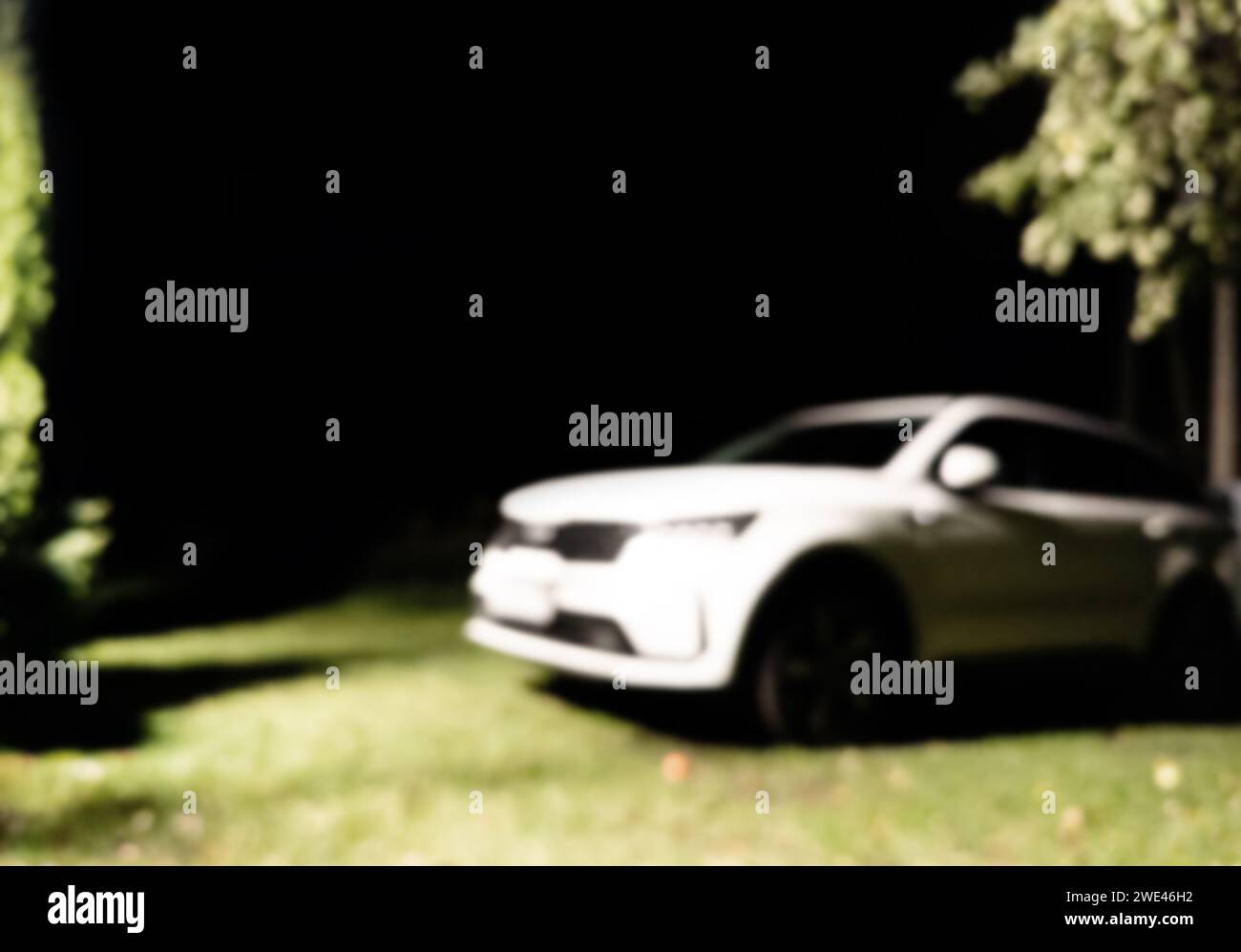 Blurred background with modern luxury car at thenight. Modern car ...