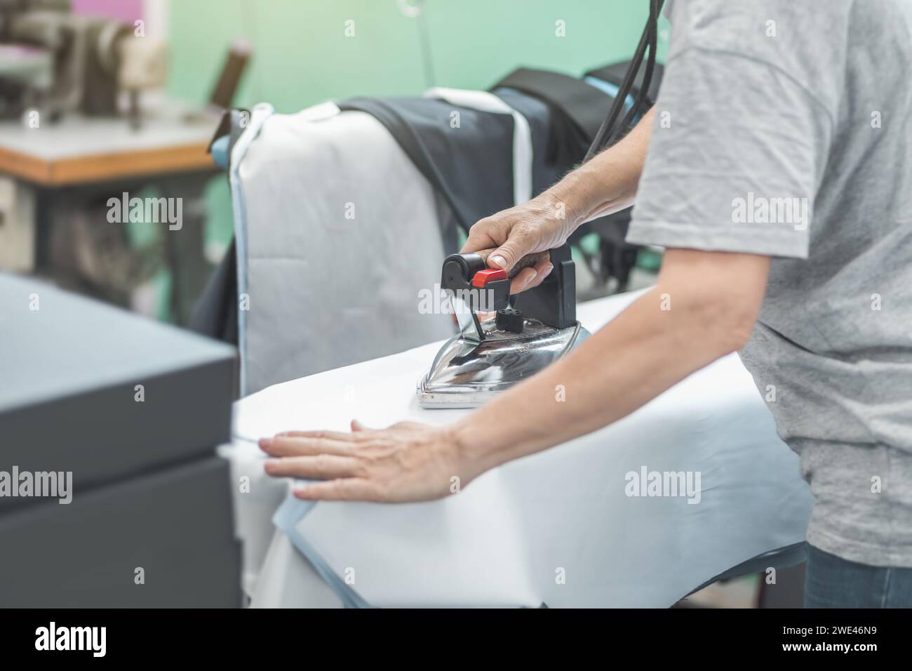 Ironing garment in clothing factory hi-res stock photography and images - Alamy