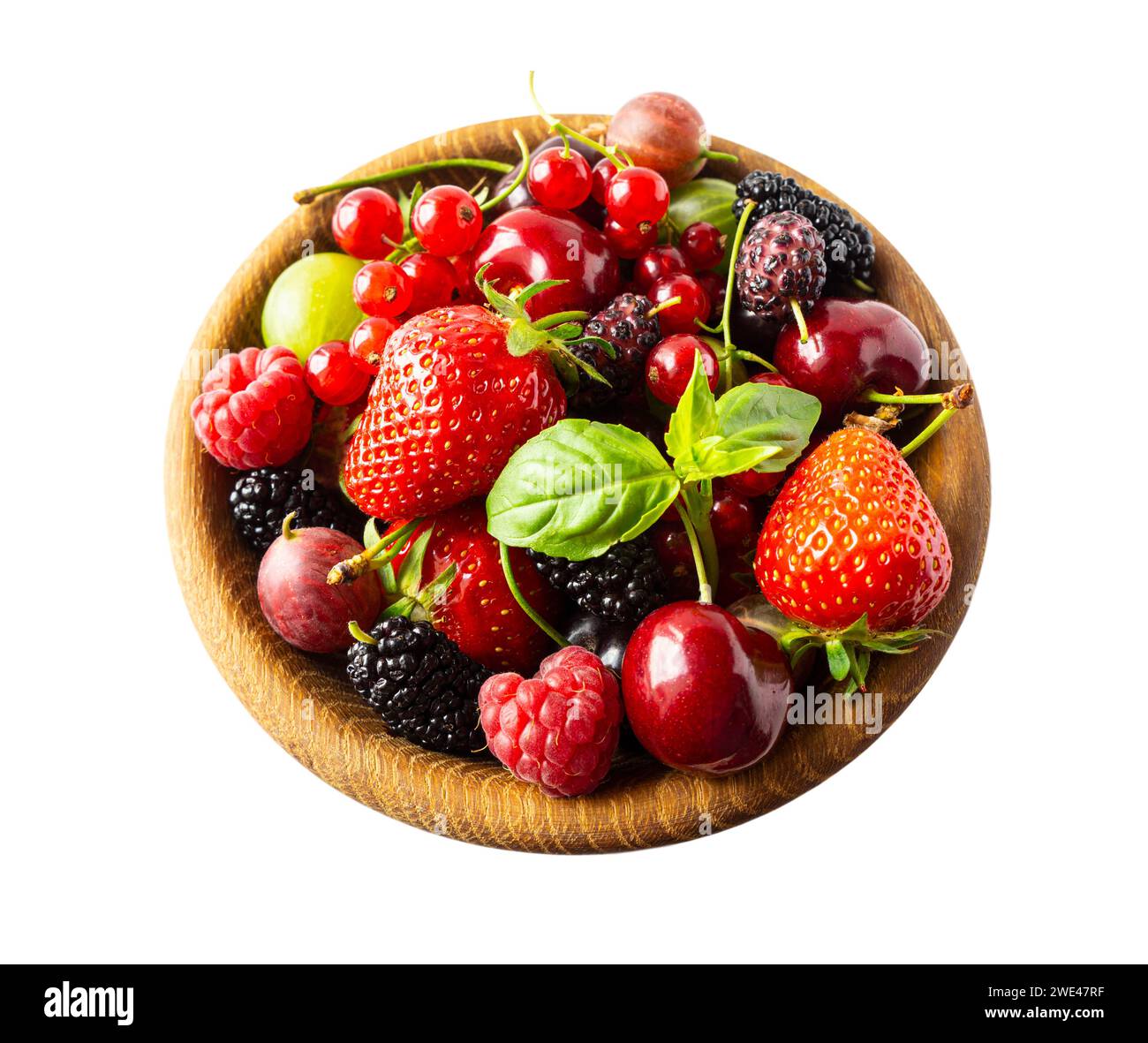 Different berries and fruits in a bowl. Mixed berries isolated in ...