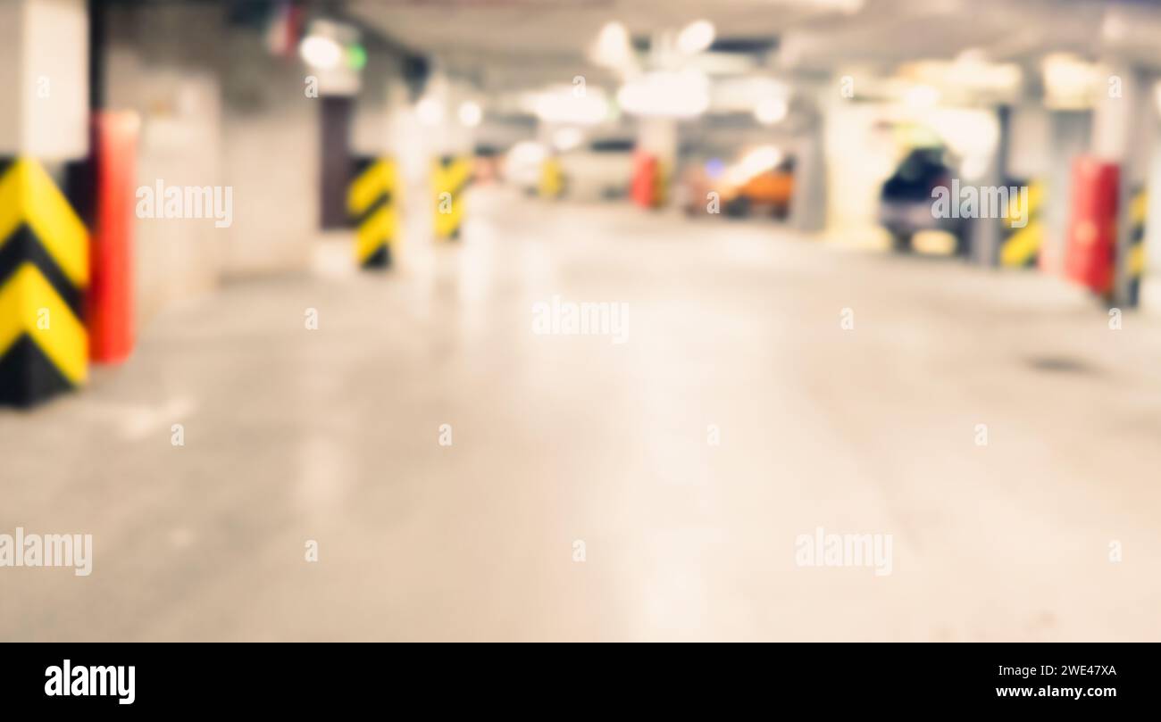 Blurred cars in car parking lot in shopping mall. Bokeh lights ...