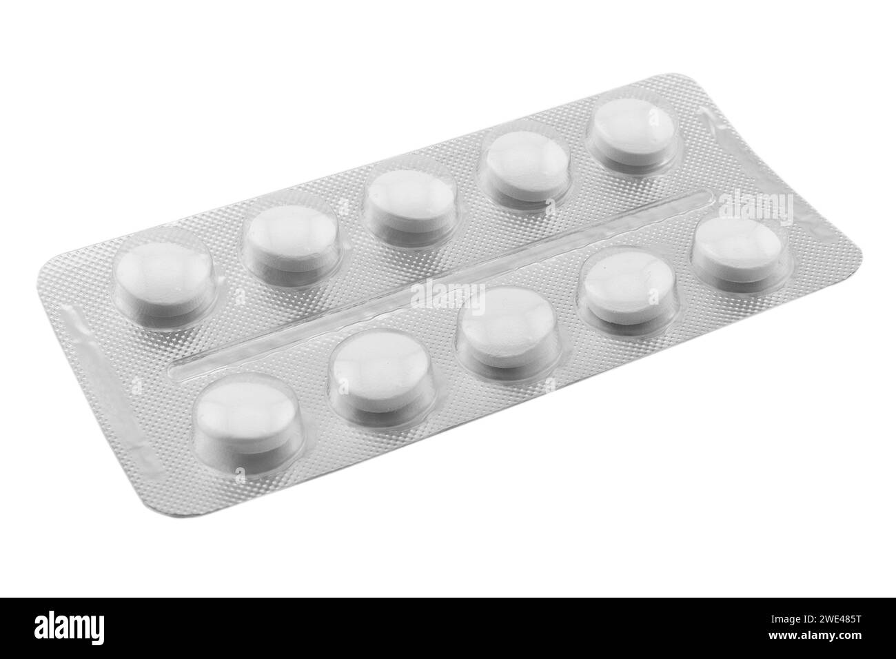 Macro shot pile of tablets pill in silver blister packaging isolated on ...