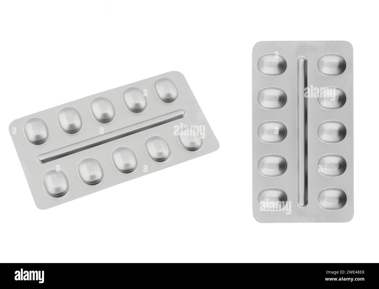 Macro shot pile of tablets pill in silver blister packaging isolated on ...