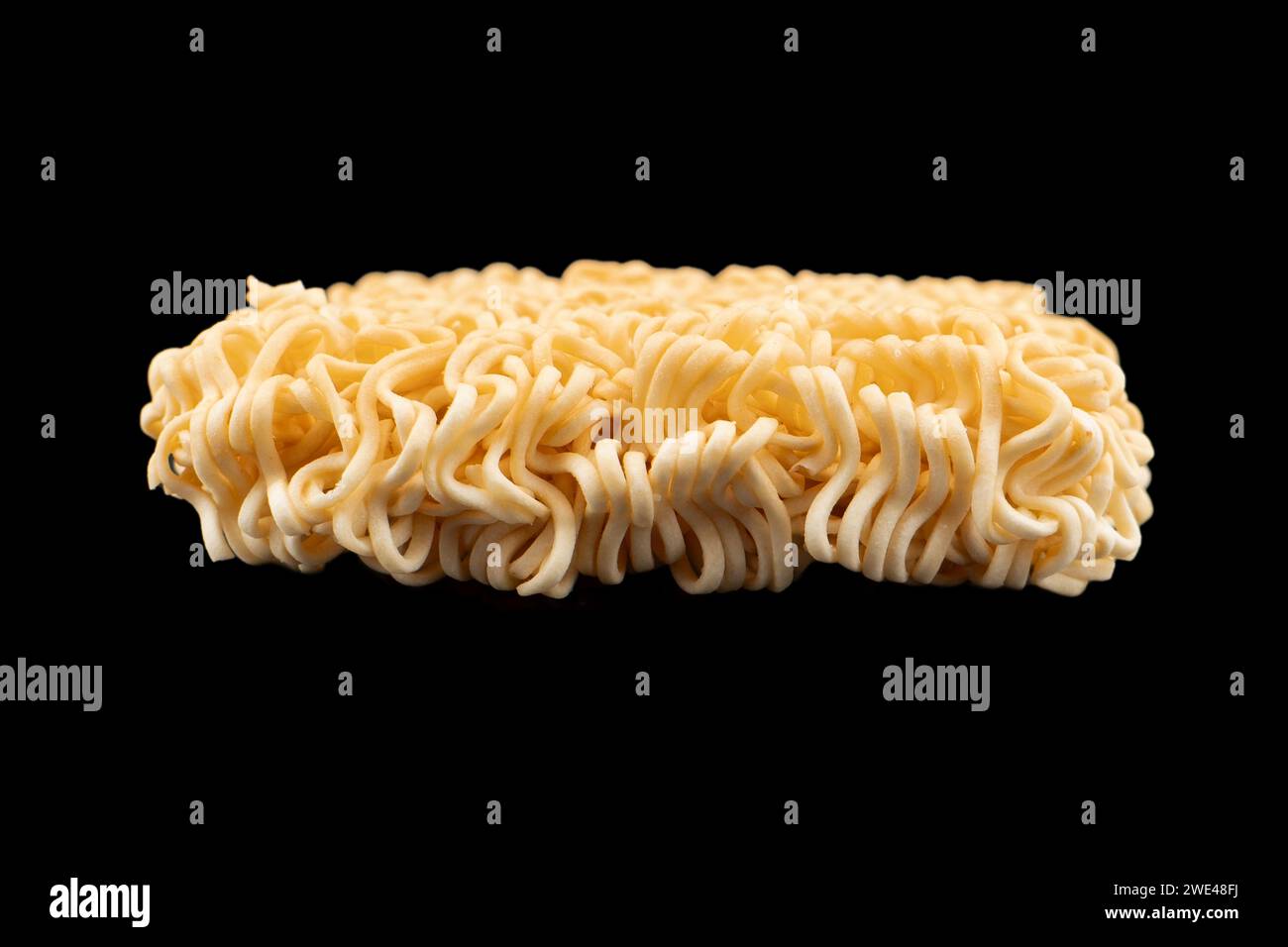 Texture of dry instant noodles isolated on black background. Raw dried ...