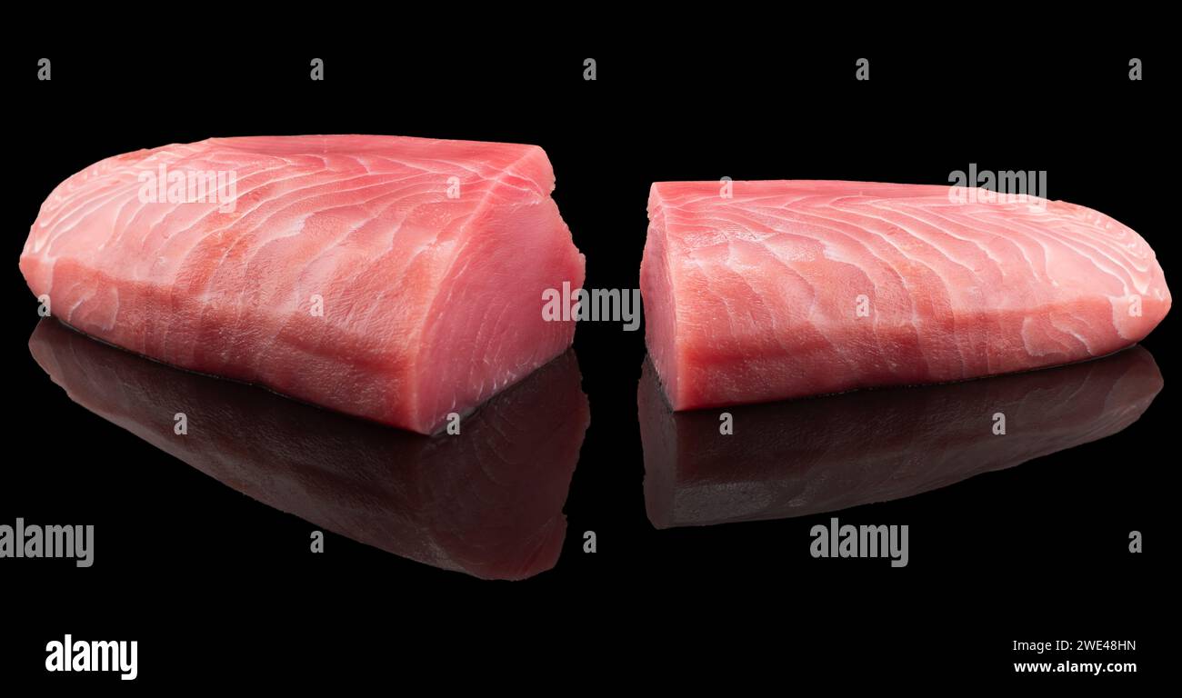 Yellow fin tuna steak isolated on black background. Fresh rare tuna ...
