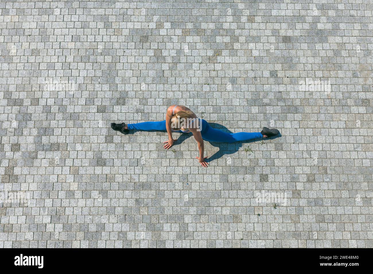 very flexible young woman stretching legs in split position Stock Photo ...