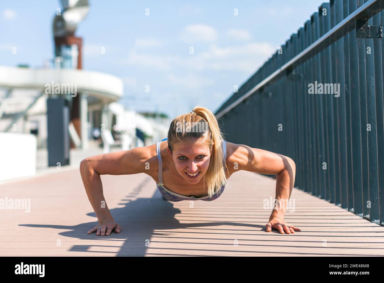 fit young woman doing pushups outdoors Stock Photo - Alamy