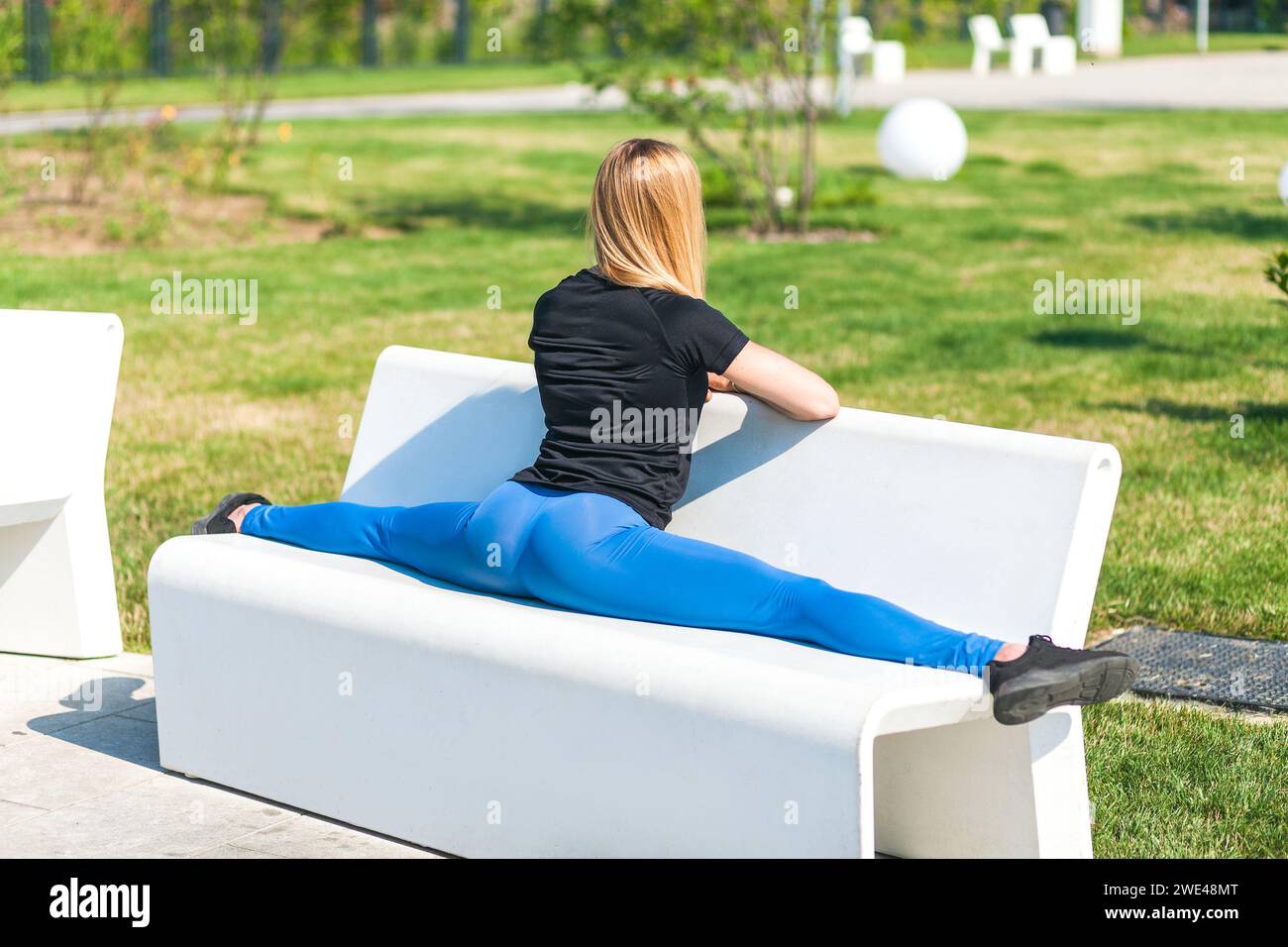 Muscular woman sitting on bench hi-res stock photography and images - Alamy