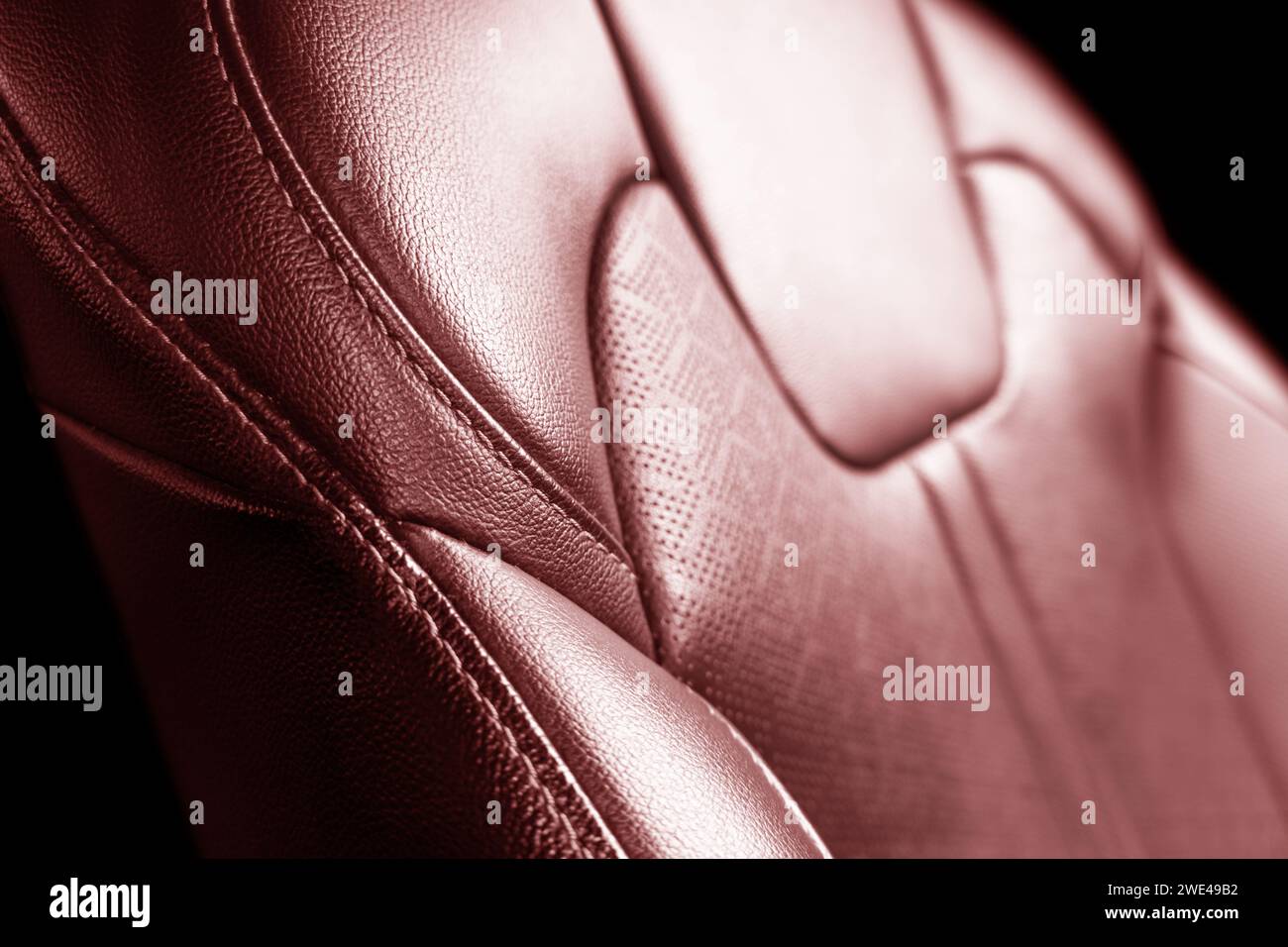 Car red leather interior. Part of red leather car seat details with ...