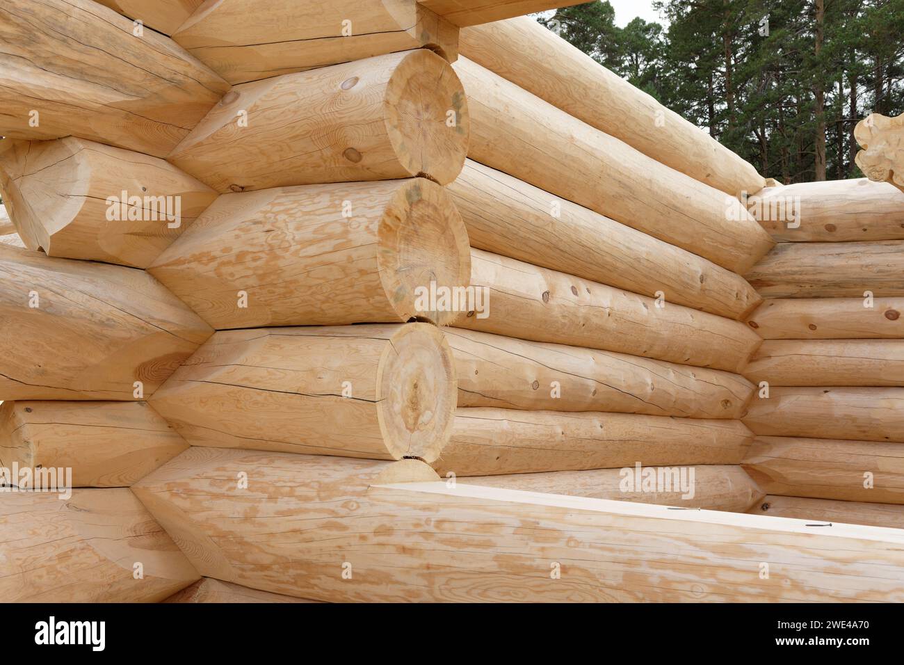 The construction site of a wooden house. Traditional log cabin built ...