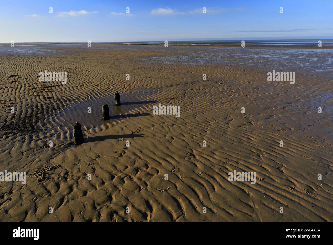 View over the sandy beach at Brancaster, North Norfolk, England, UK ...
