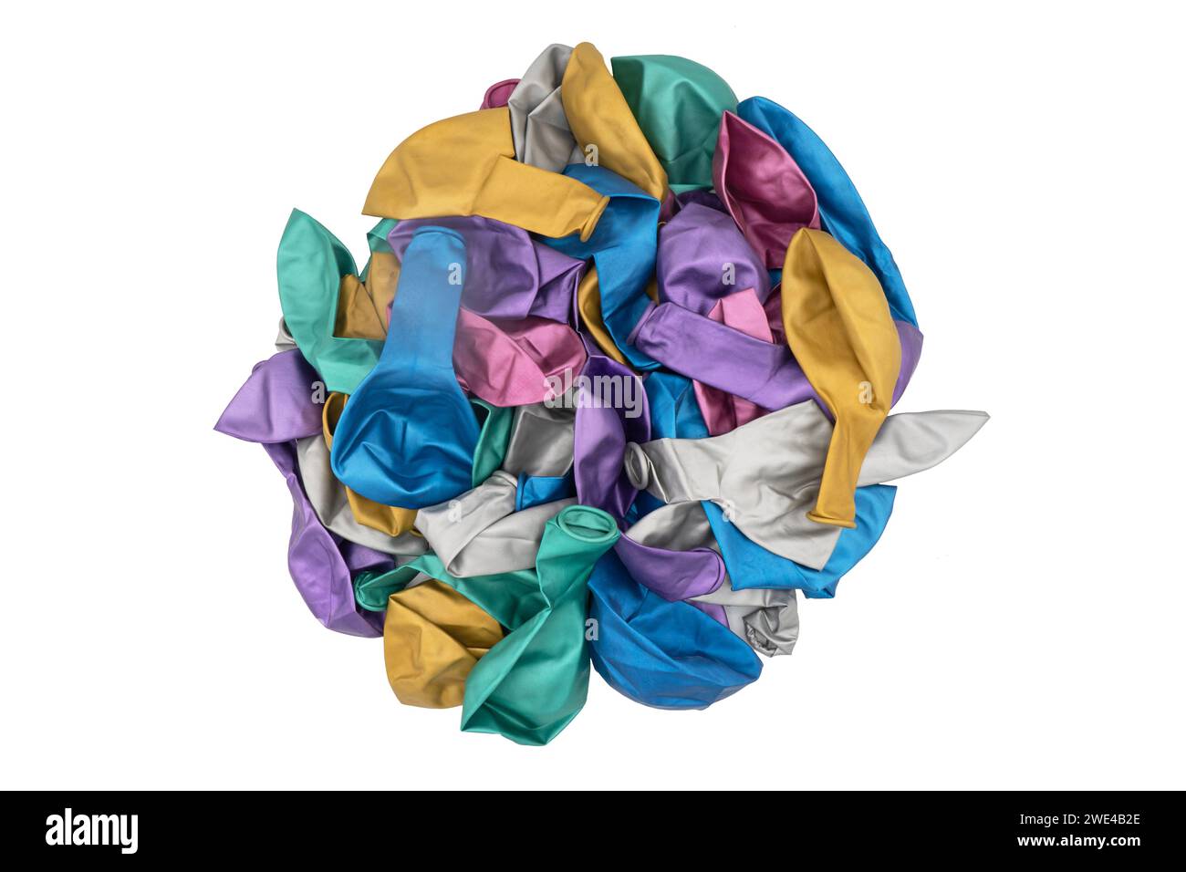 Top view of colorful deflated balloons isolated on a white background ...