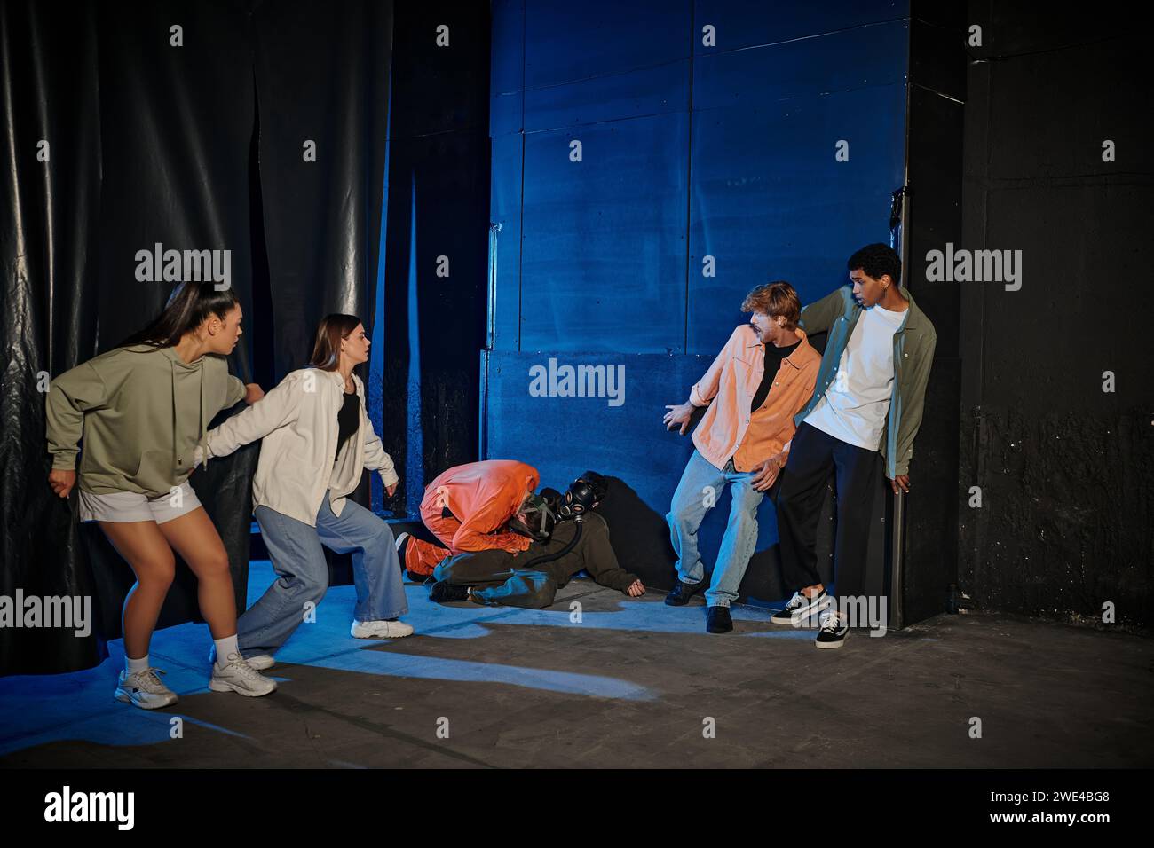 scared multicultural friends escaping from freaky people in gas masks ...