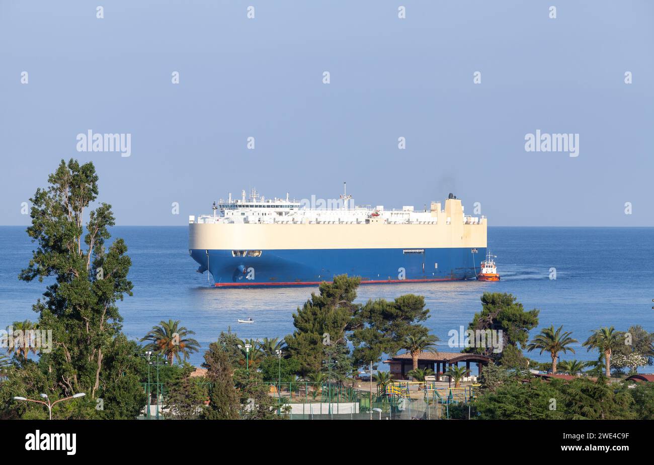 Side view of a big car carrier ship Roll on Roll off entering port ...