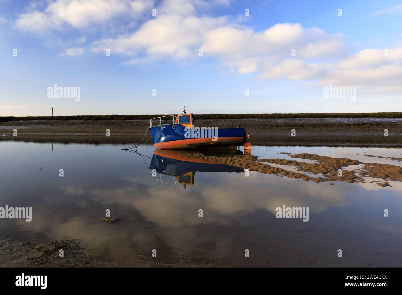 Fishing boat in the estuary at Burnham Overy Staithe village, North ...