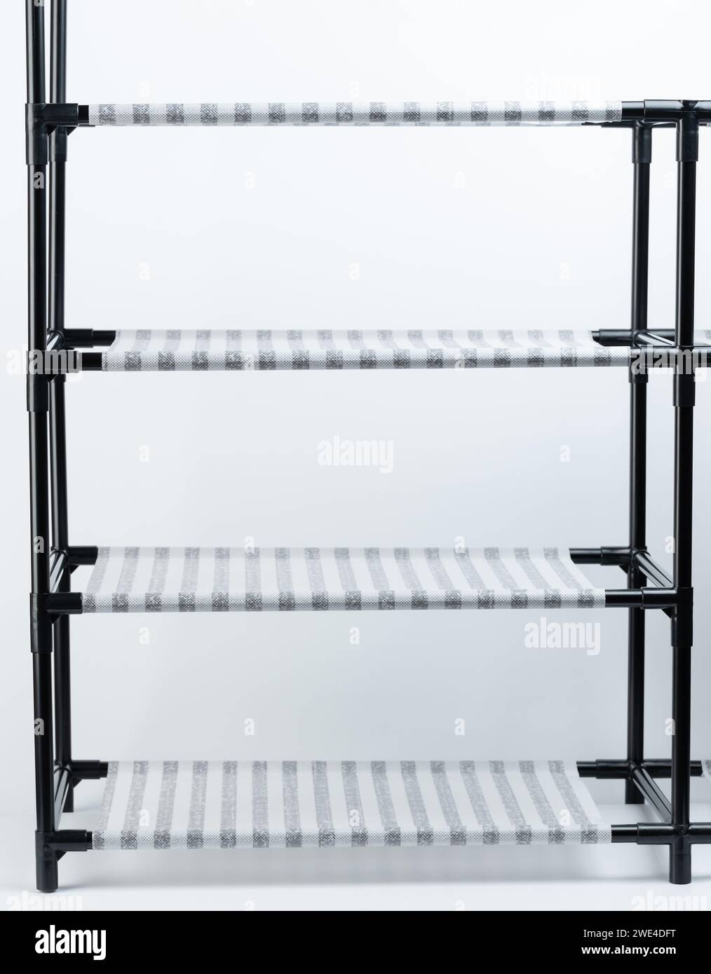 Empty shoe open rack isolated on white studio background Stock Photo ...