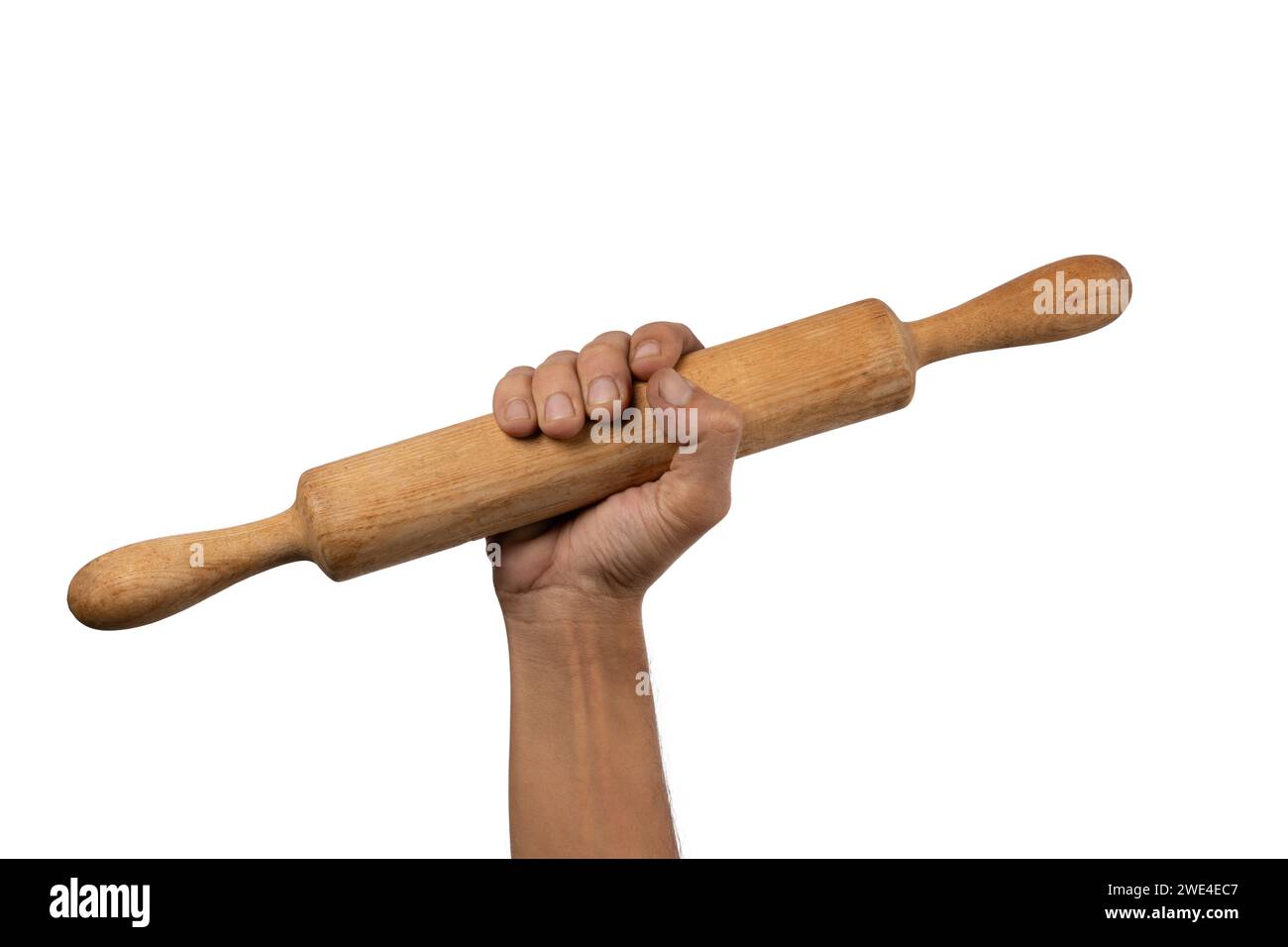 Hand holding a wooden rolling pin isolated on white background Stock ...