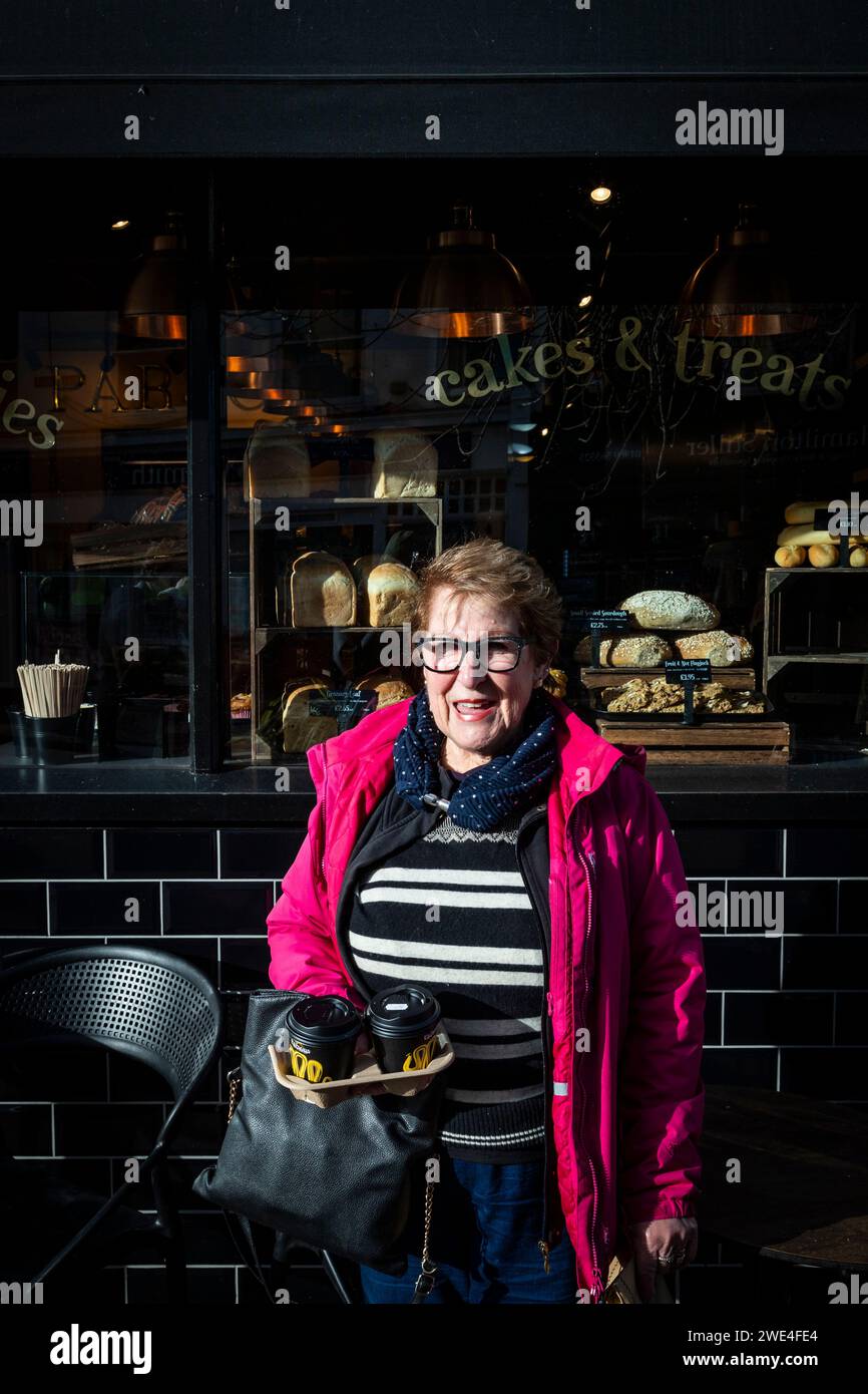 Bakery customer with take out coffee Stock Photo - Alamy