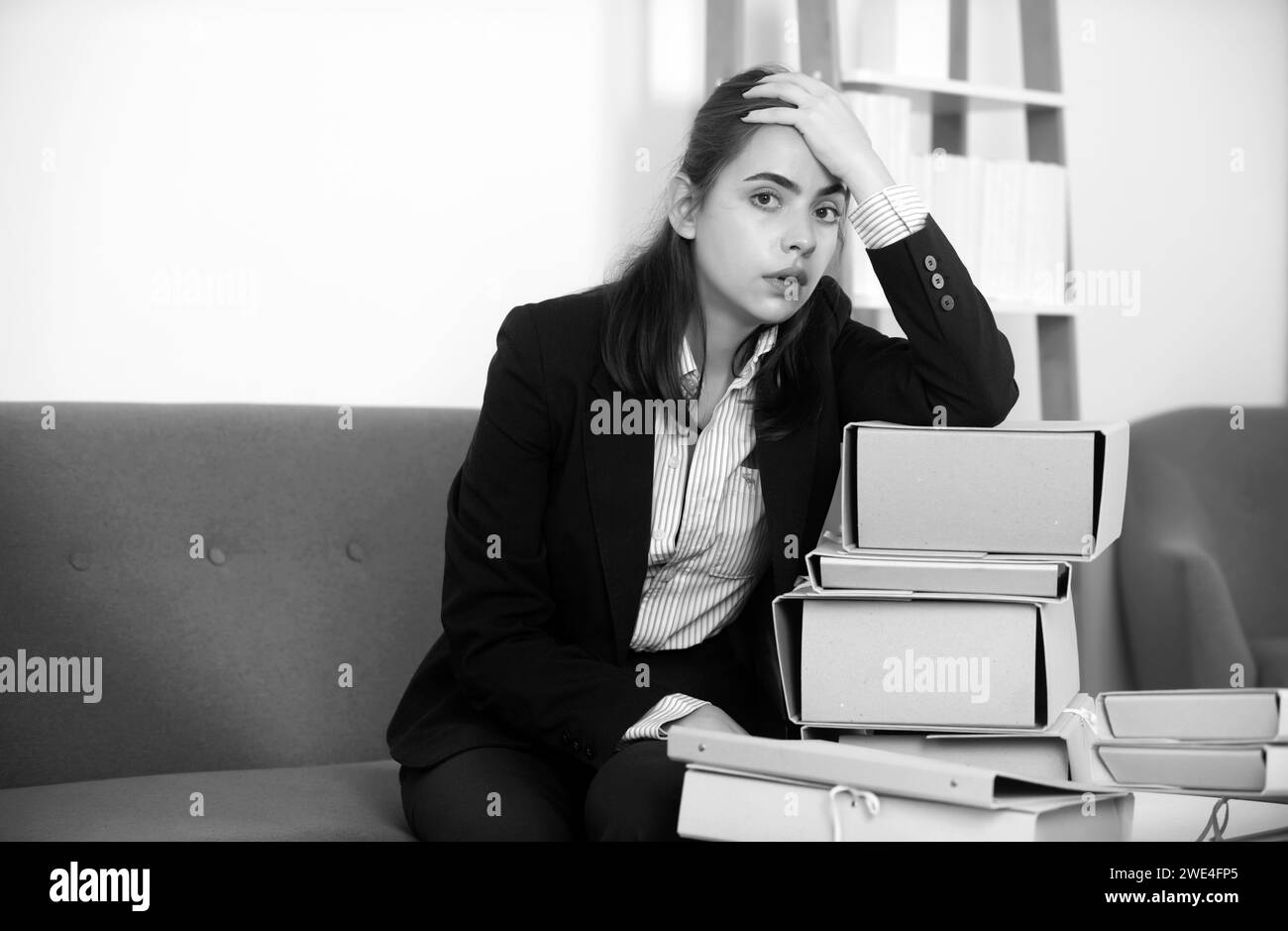 Busy business woman, secretary girl working alone late in office. Angry ...