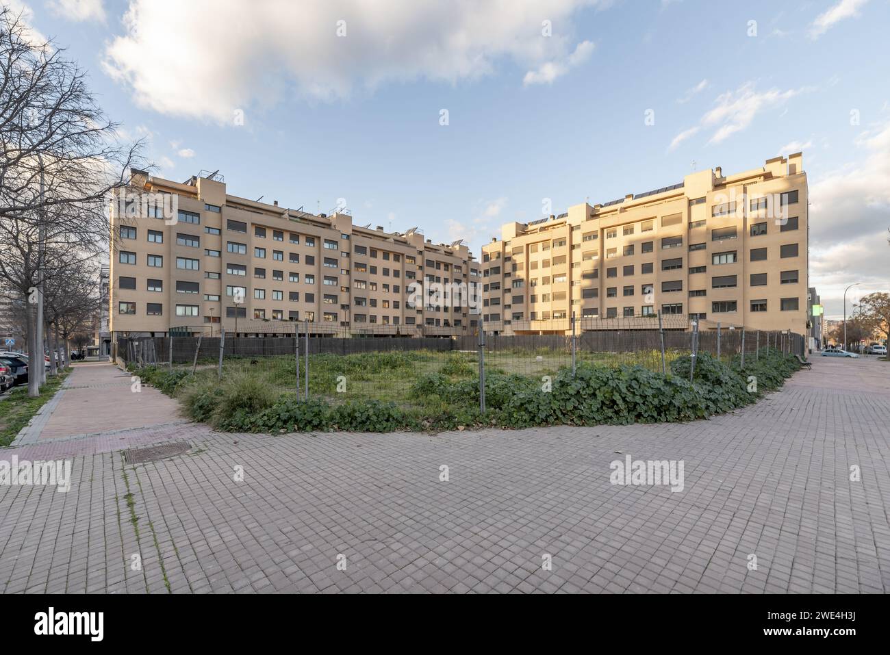 Facades of residential buildings filled with small balconies and ...