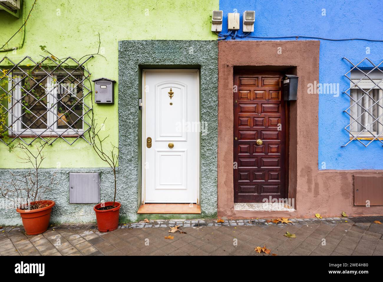 Access doors to homes on the facade of a residential house made of ...
