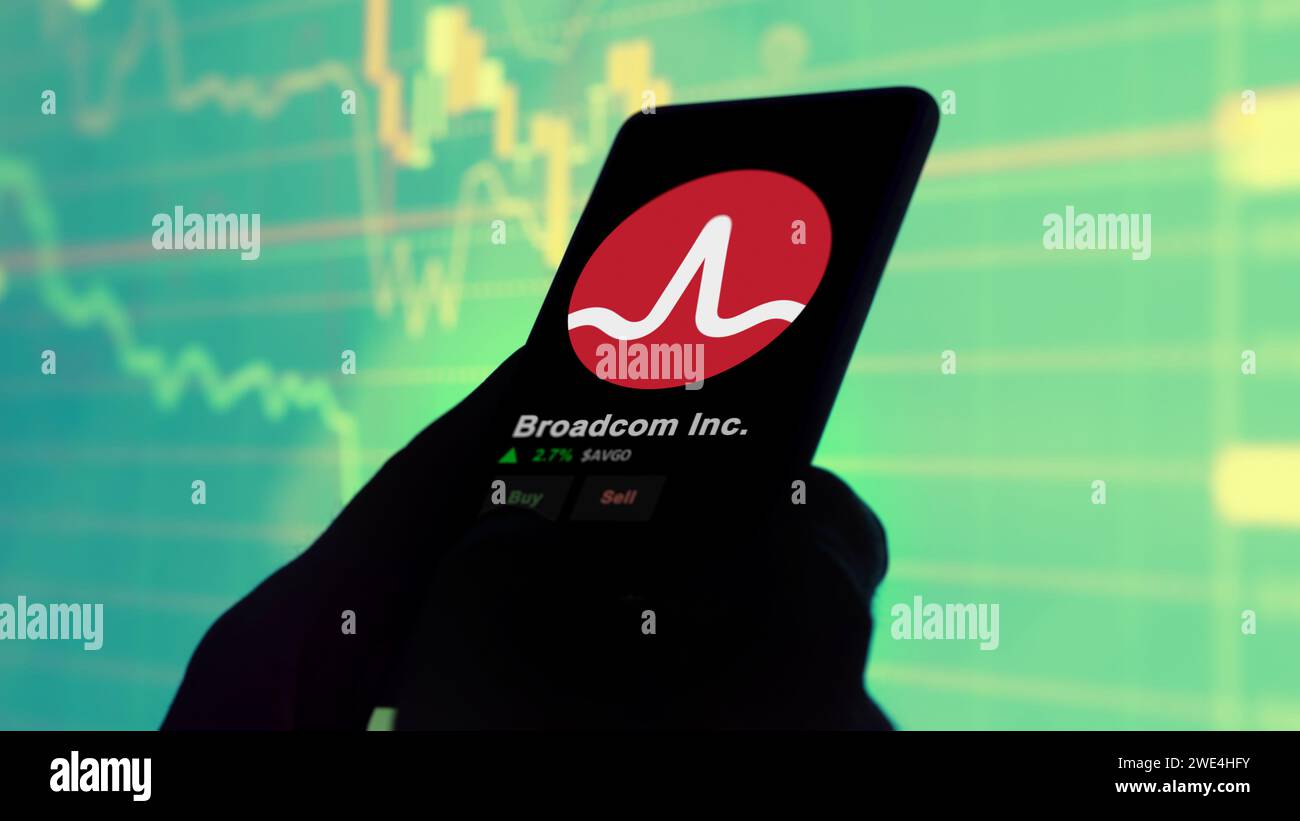 Logo of Broadcom Inc. on the screen of an exchange. Broadcom Inc price stocks, $AVGO on a device ...