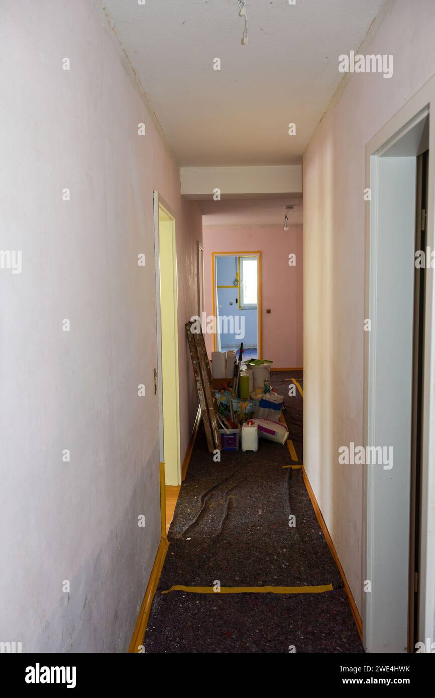 A room in an apartment during renovation with the floor taped off to ...