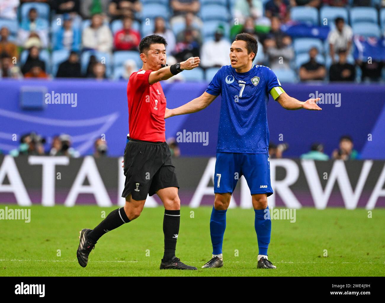Doha, Qatar. 23rd Jan, 2024. Otabek Shukurov (R) of Uzbekistan gestures ...