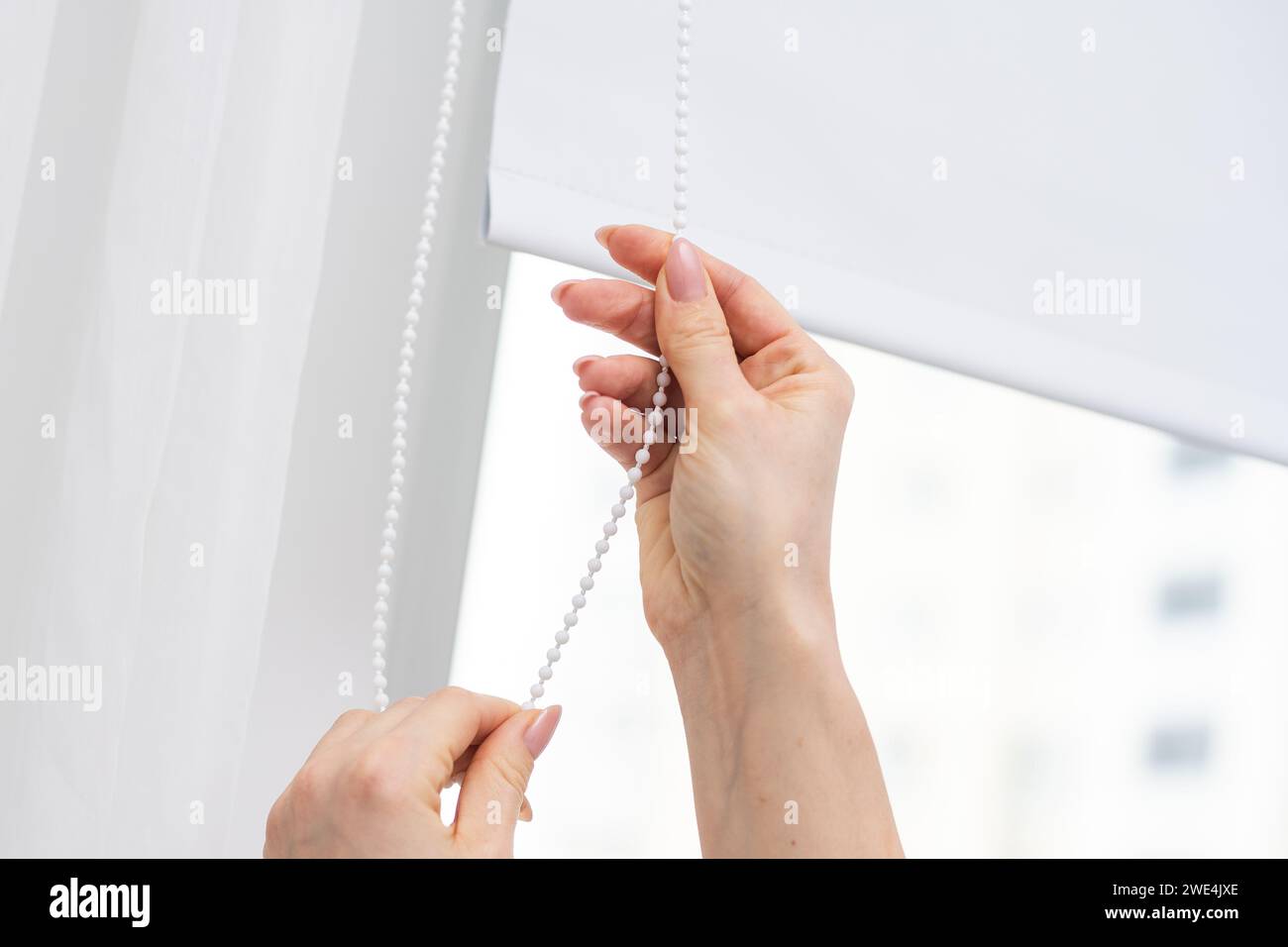 hand pull rope. isolated on white background Stock Photo - Alamy