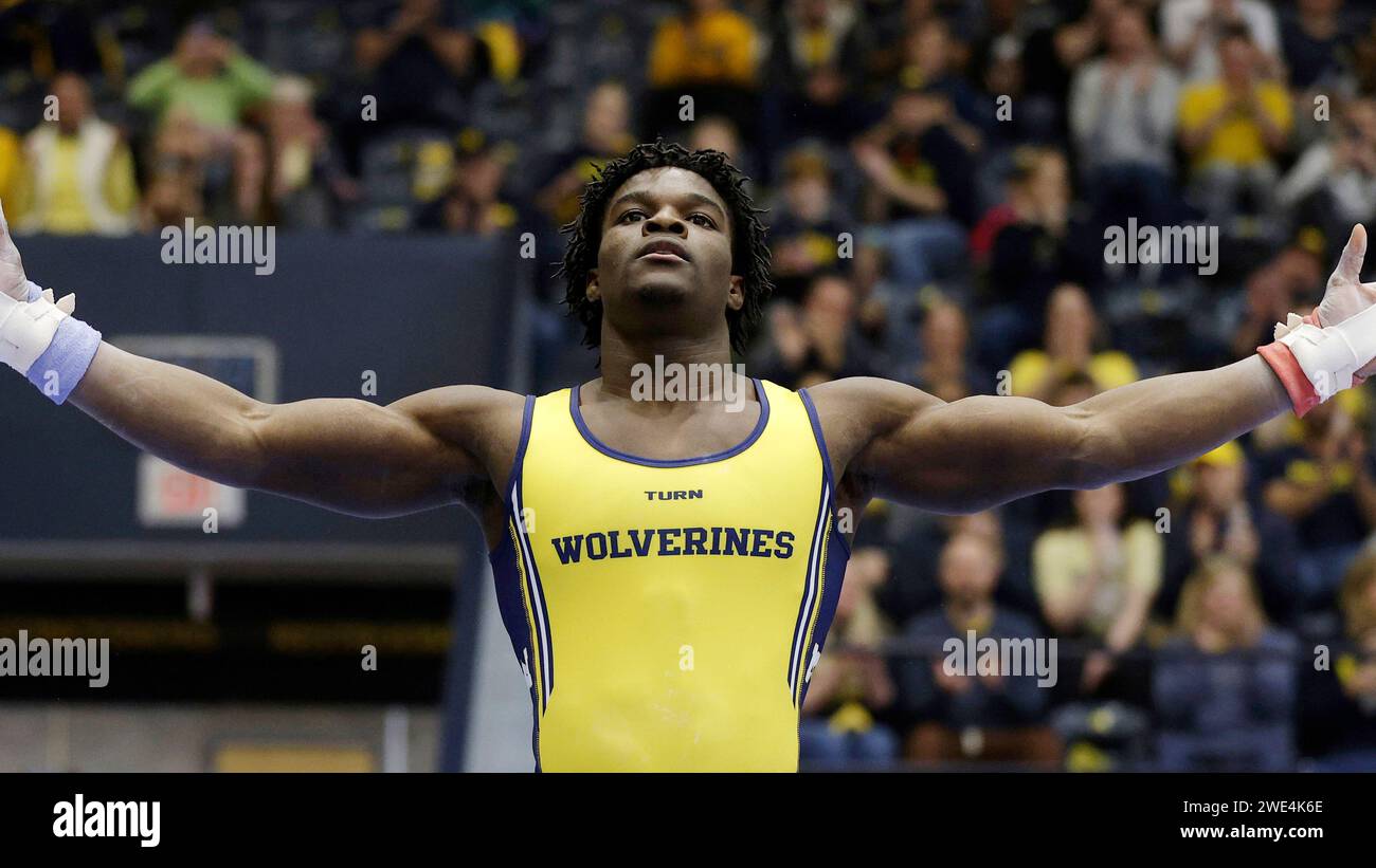 Michigan's Fred Richard competes on the high bar during an NCAA ...