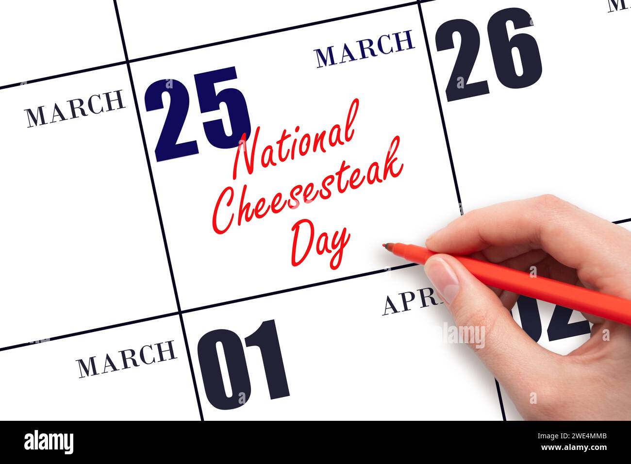 March 25. Hand writing text National Cheesesteak Day on calendar date ...