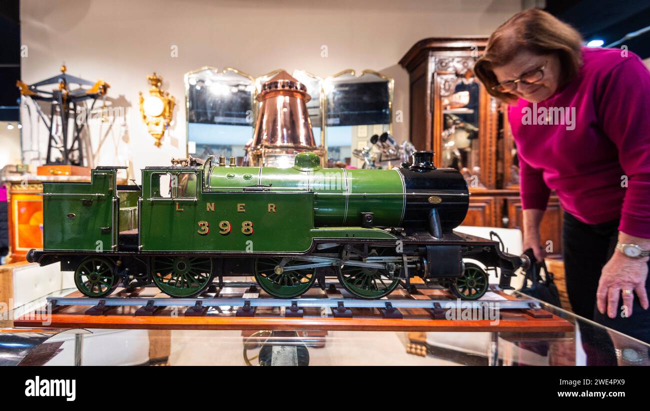 London, UK. 23 January 2024. A visitor views 'a 5 inch gauge model of ...