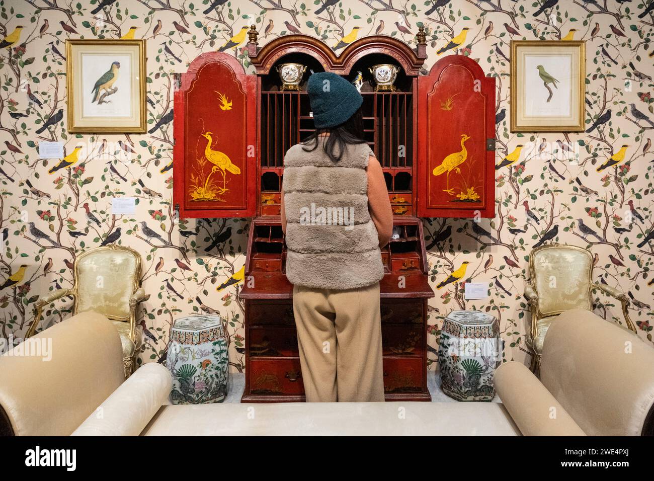 London, UK. 23 January 2024. A visitor views a 'Queen Anne bureau ...