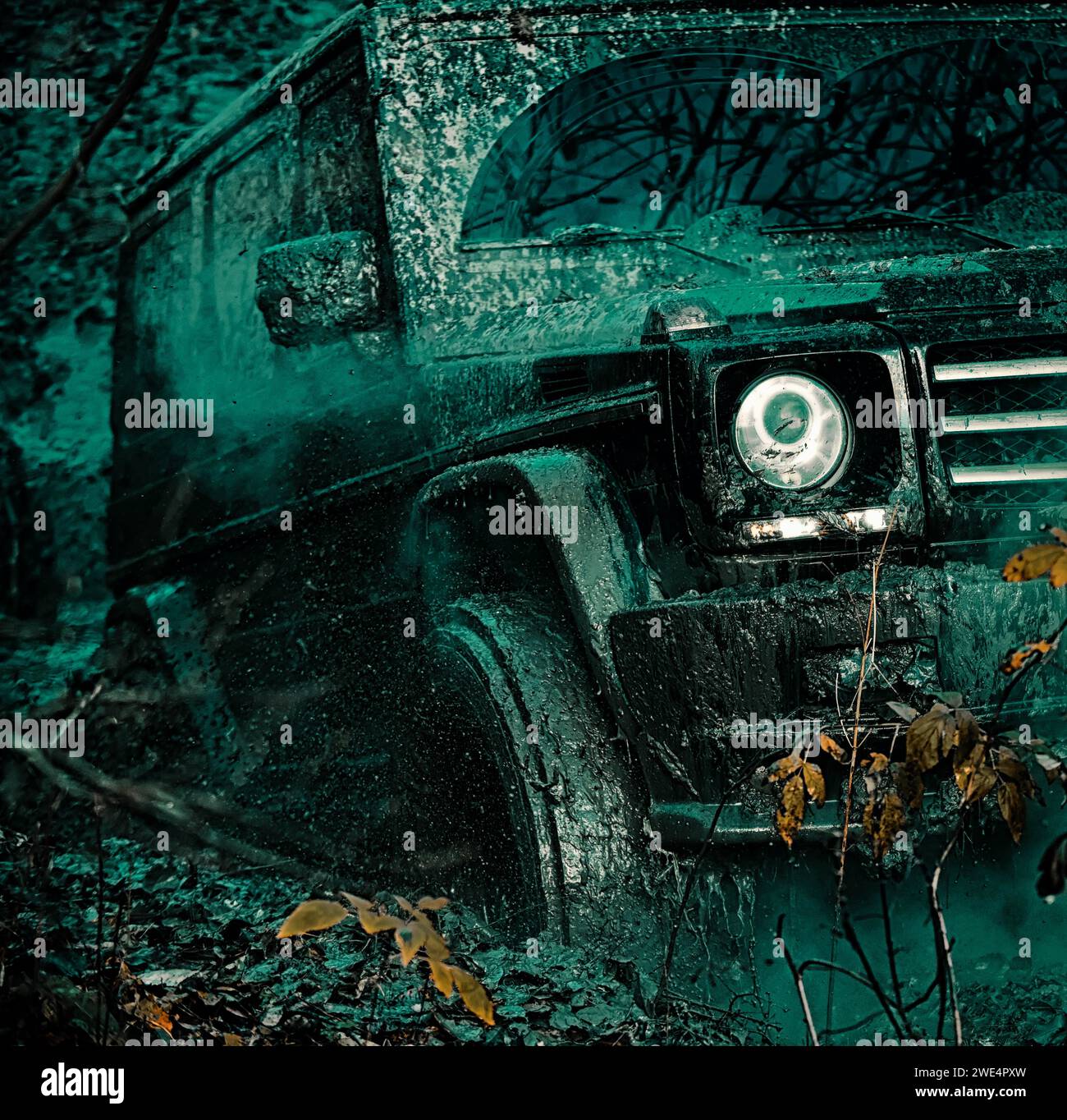 Bottom view to big offroad car wheel on country road and mountains ...