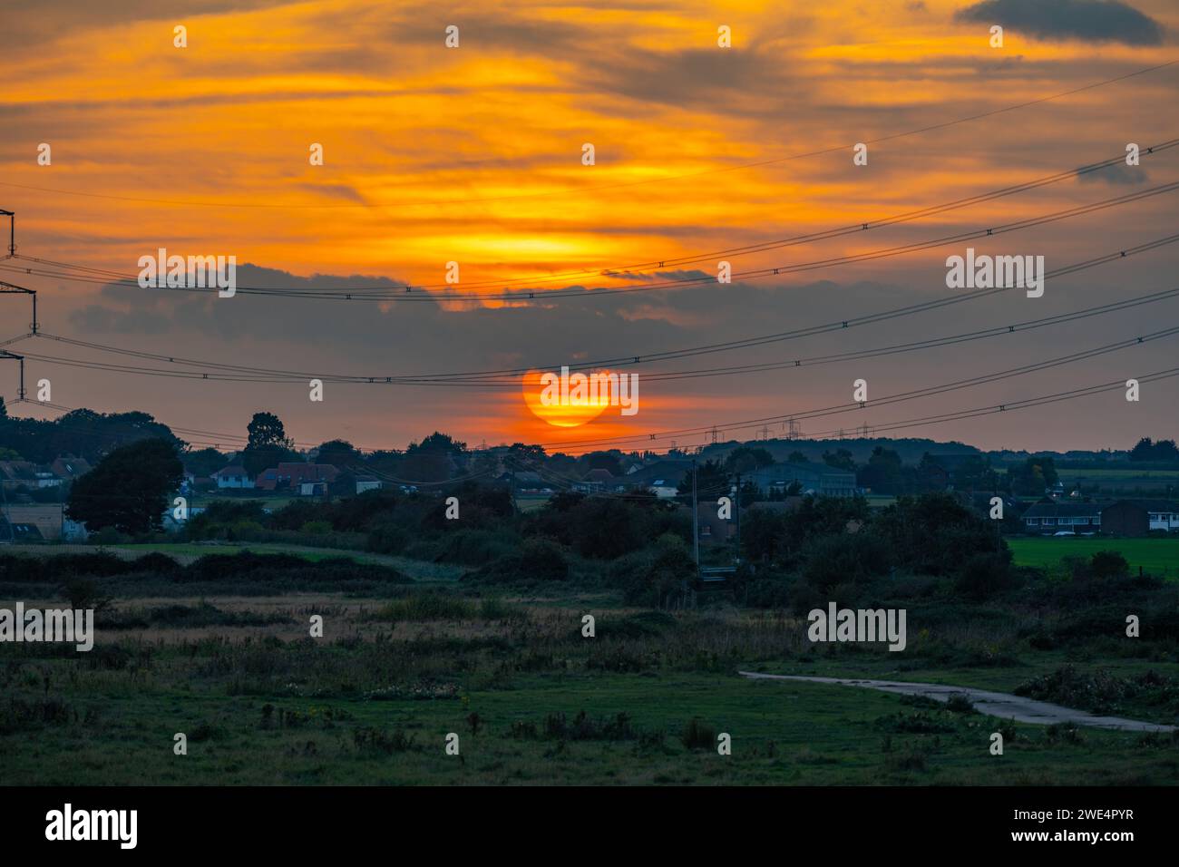 Sunset behind Lower Stoke on the grain peninsula Kent Stock Photo - Alamy