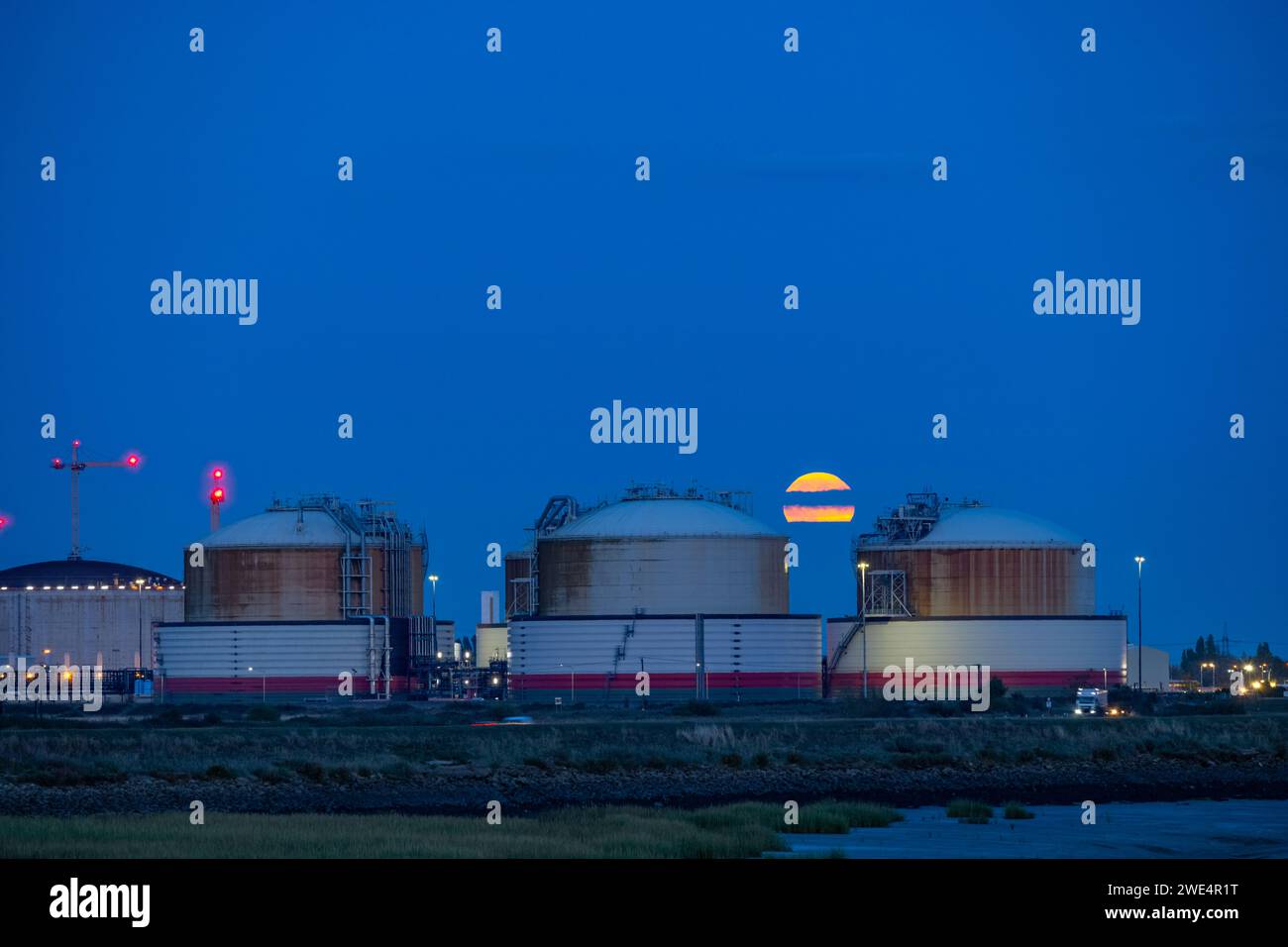 Moonrise behind National Grid Liquid Natural Gas terminal at Grain Kent ...