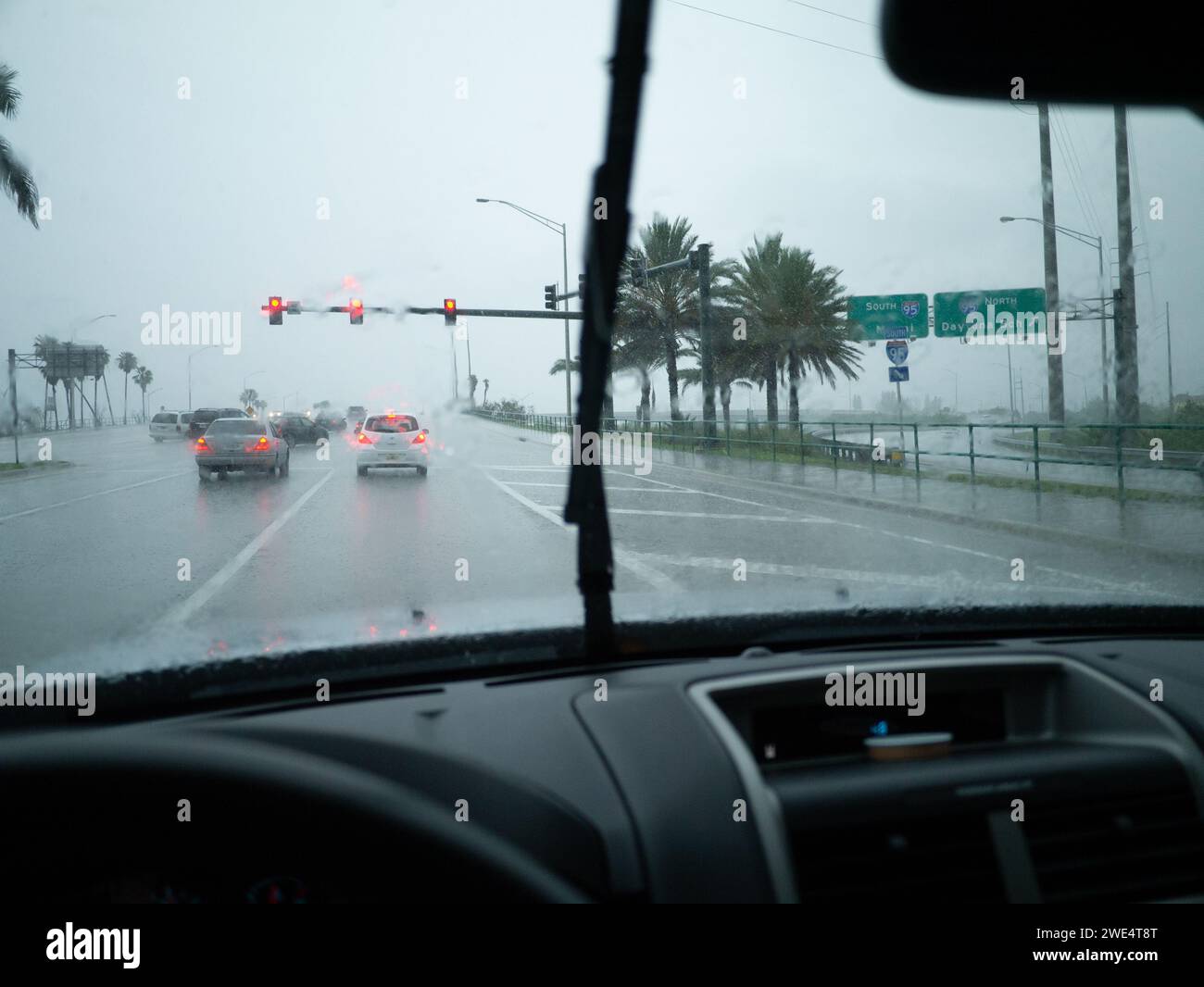 Heavy rain seen through the windscreen of a car on a highway in Miami ...