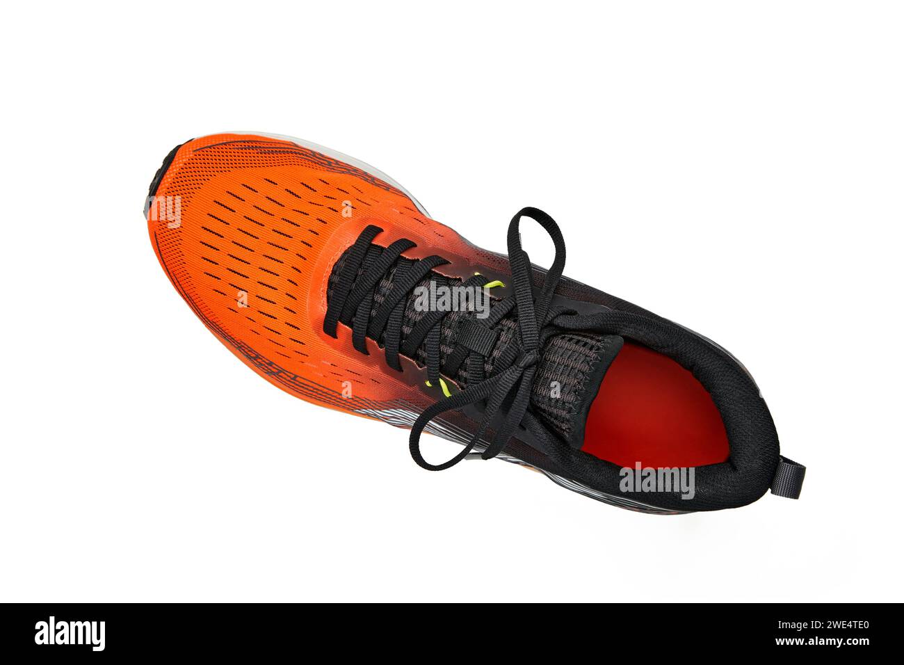 Left orange sneaker isolated on white background. Top view with copy ...