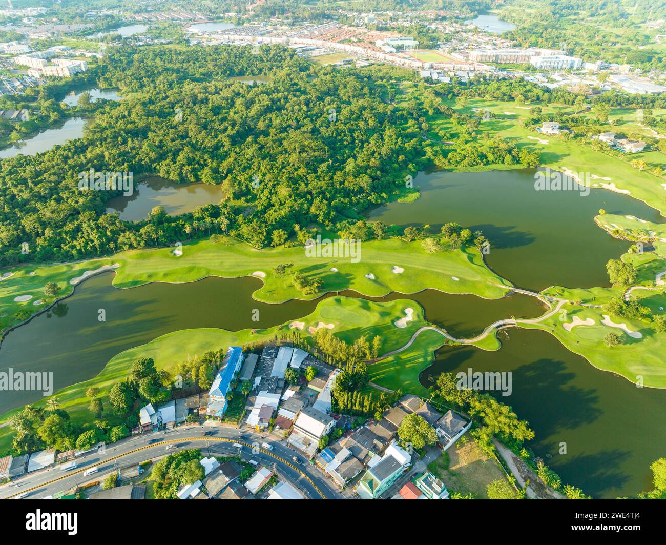 Aerial view of beautiful green golf field fairway and putting green ...