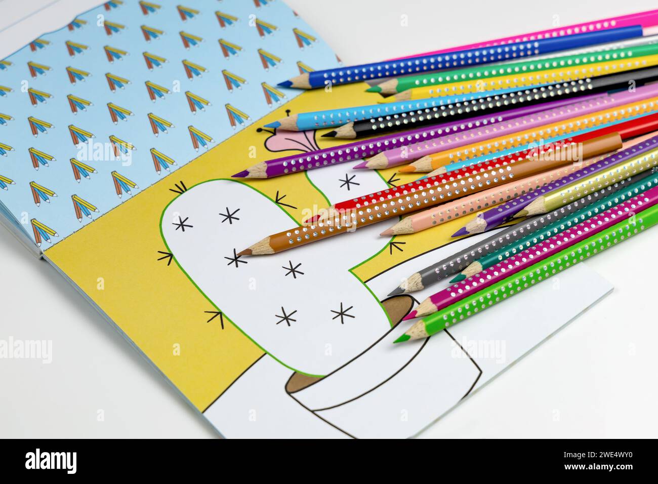 Colored pencils for drawing various colors and coloring book for ...