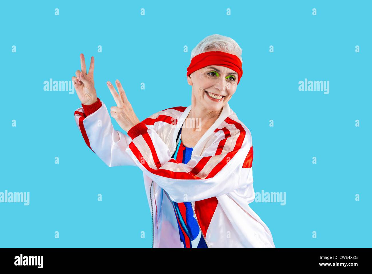 Happy and funny senior old woman wearing sportswear clothing on ...
