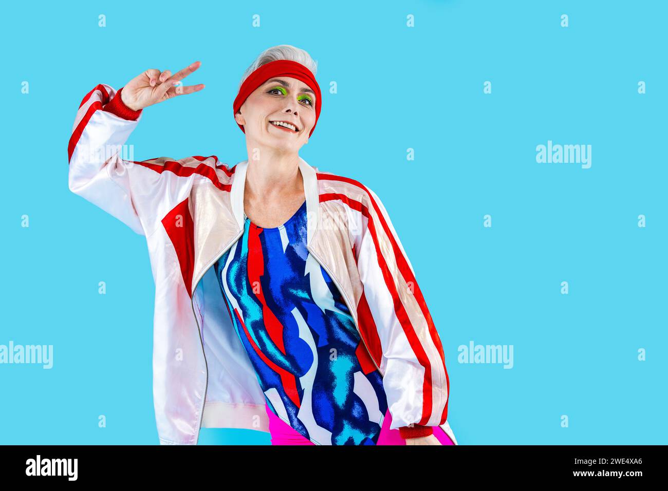 Happy and funny senior old woman wearing sportswear clothing on ...