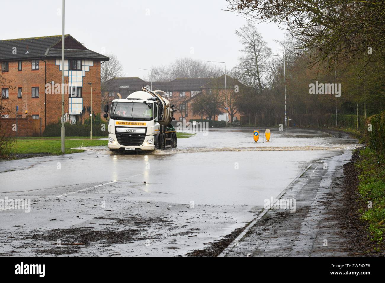 Car drives through flooded road hi-res stock photography and images - Alamy