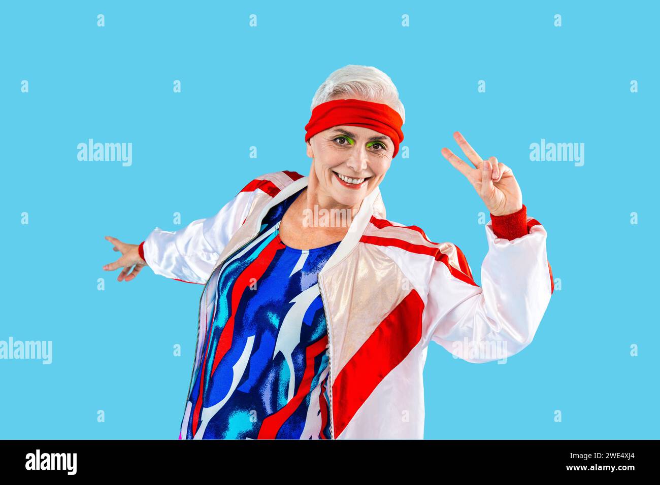 Happy and funny senior old woman wearing sportswear clothing on ...