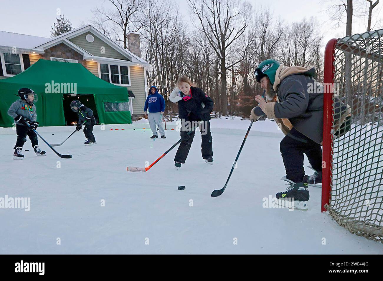 From left; Michael Lamia, 6, Nicholas Romero, 6, and Mike Lamia look on ...